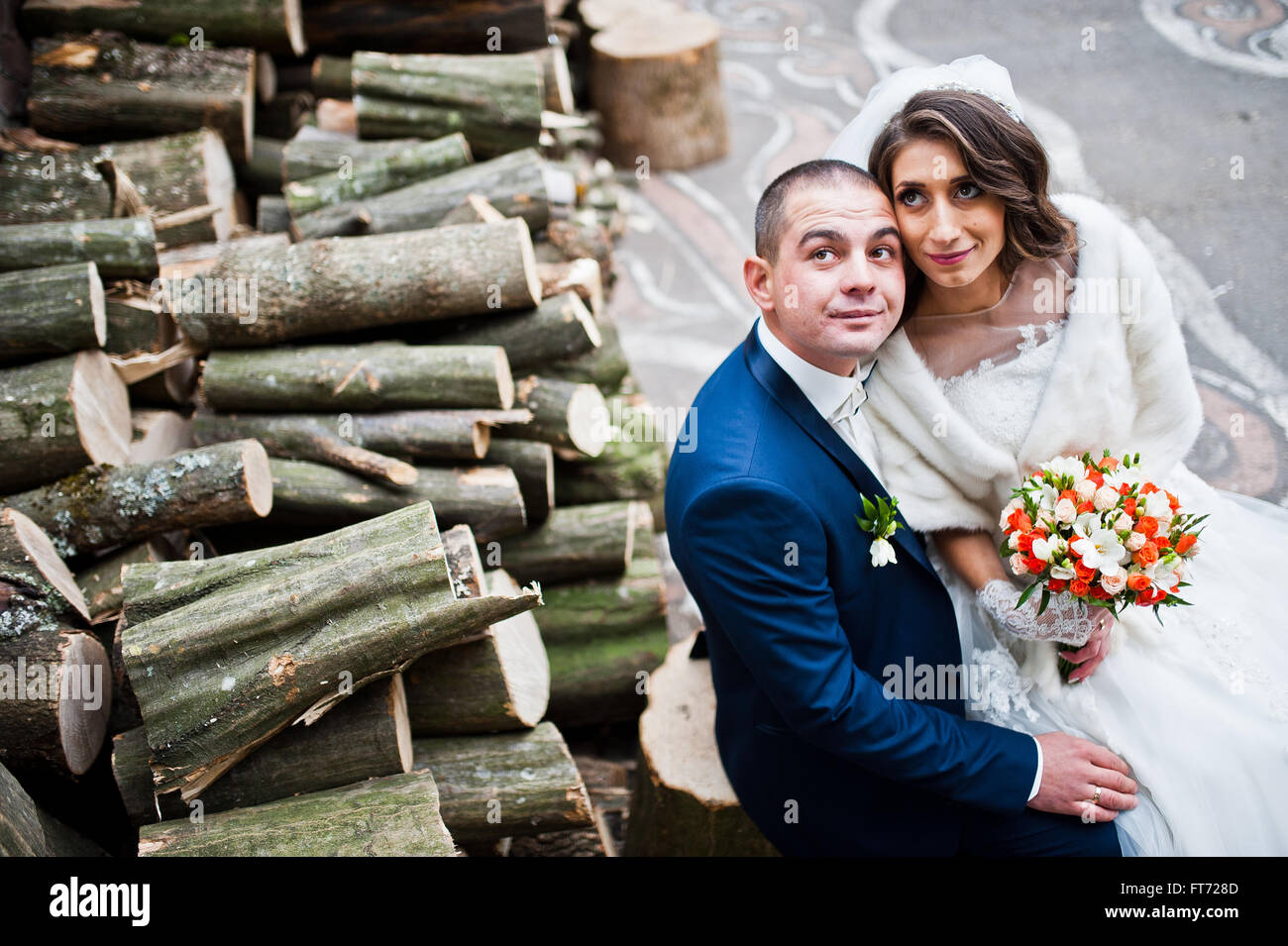 Wedding couple siitting background many stumps Stock Photo - Alamy