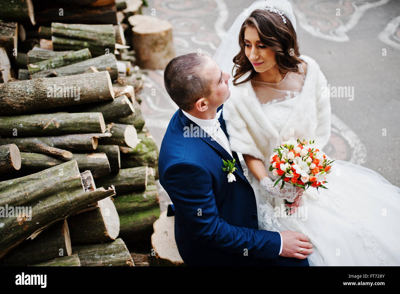 Wedding couple siitting background many stumps Stock Photo - Alamy