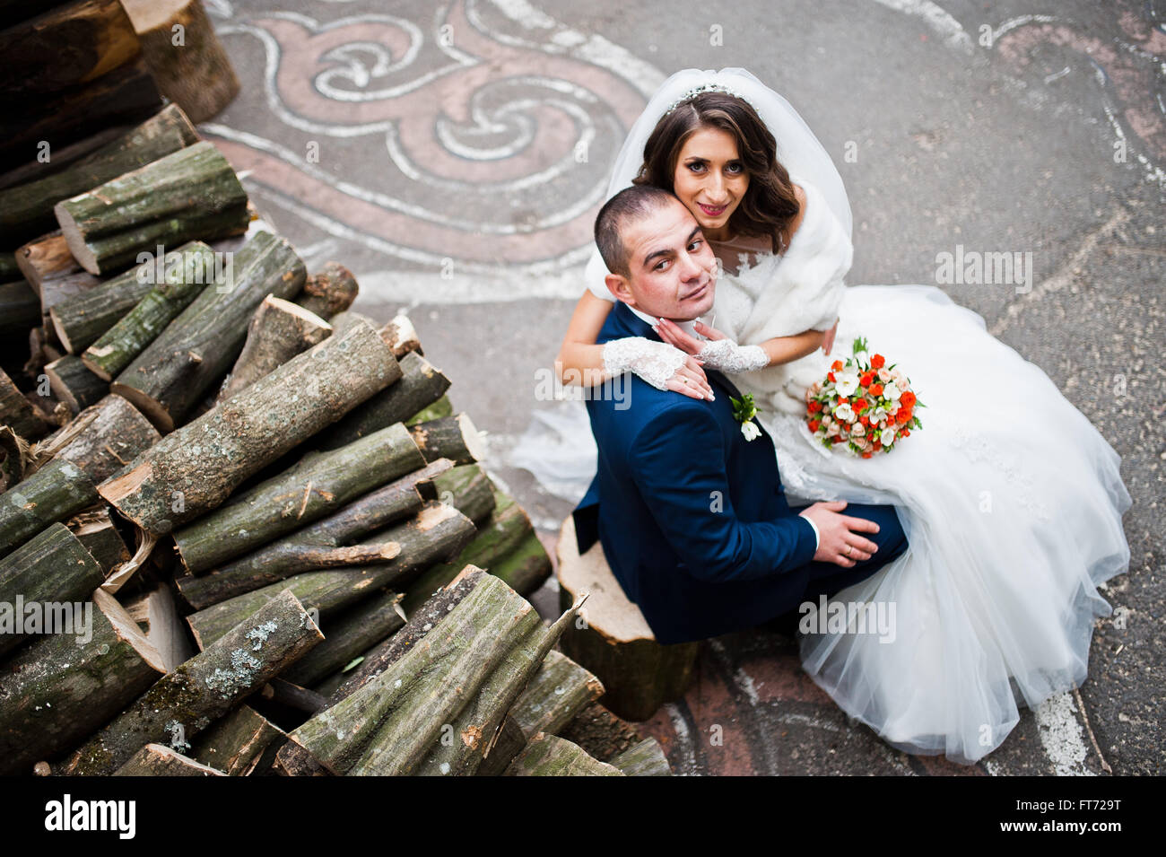 Wedding couple siitting background many stumps Stock Photo - Alamy