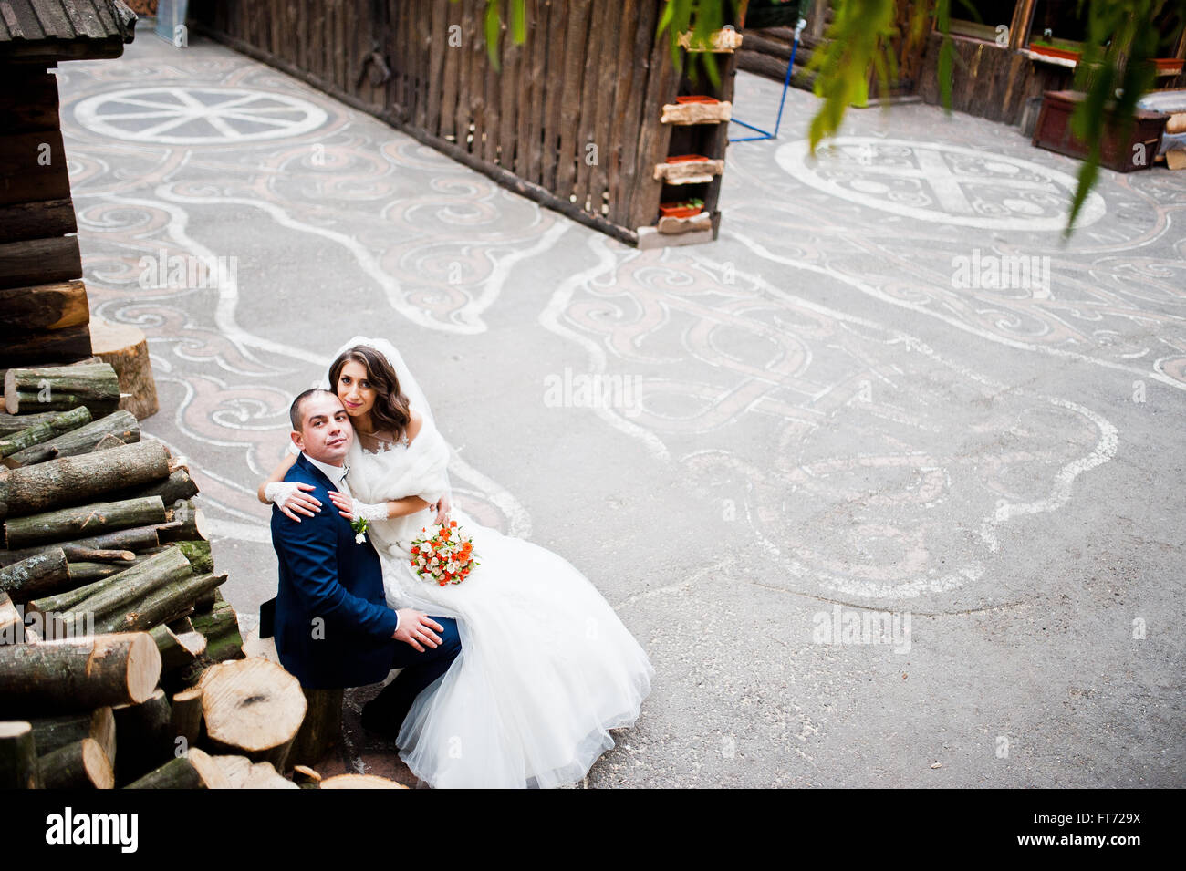 Wedding couple siitting background many stumps Stock Photo - Alamy