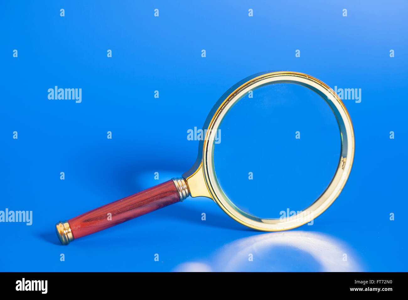 Blue magnifying optical search hi-res stock photography and images - Alamy