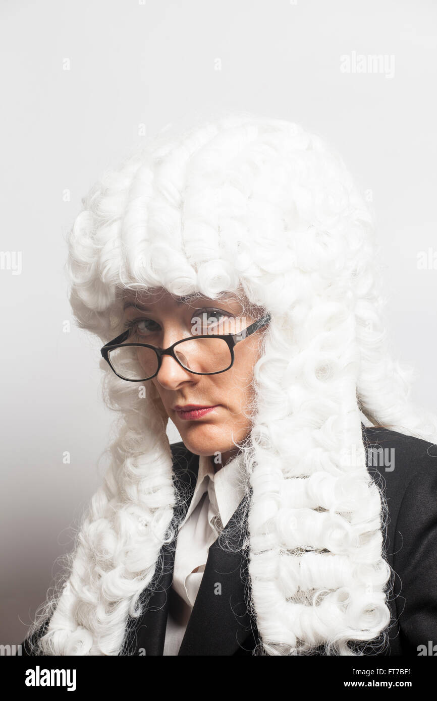 Female judge wearing a wig with eyeglasses on white Stock Photo - Alamy