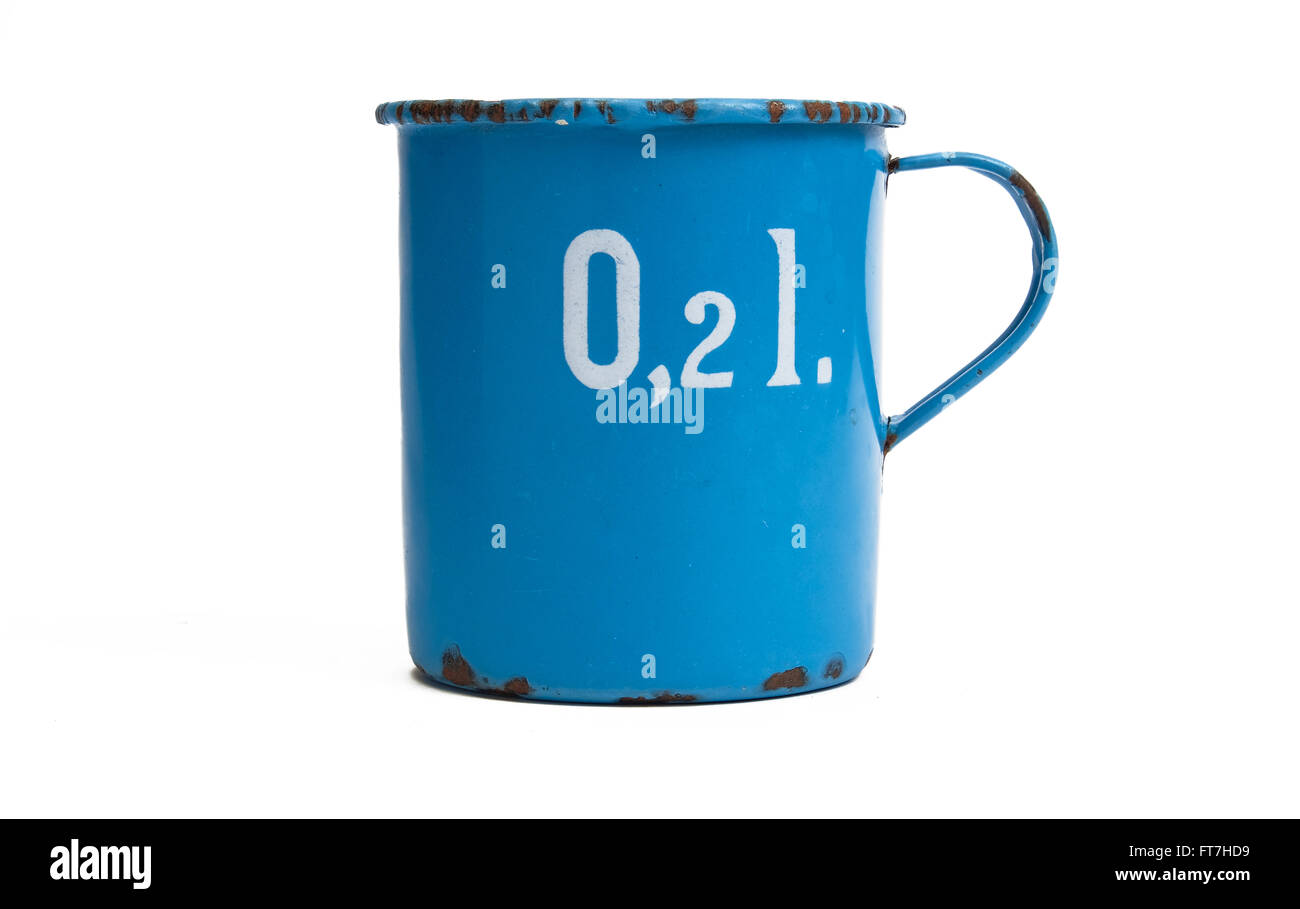 small blue enamel jug standing on a white background Stock Photo - Alamy