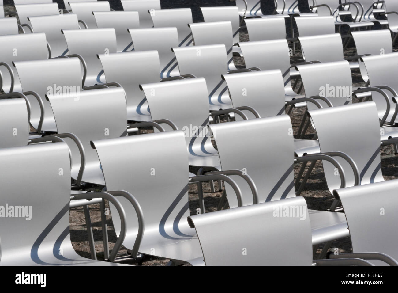Rows of empty metal chairs Stock Photo - Alamy
