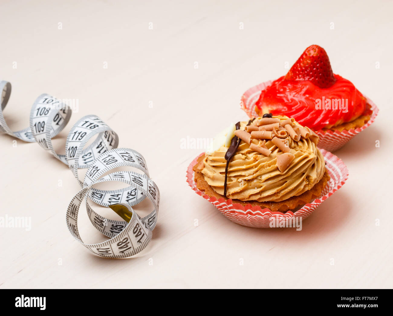 Appetite and gluttony concept. Fattening problem. Cakes cupcakes with ...
