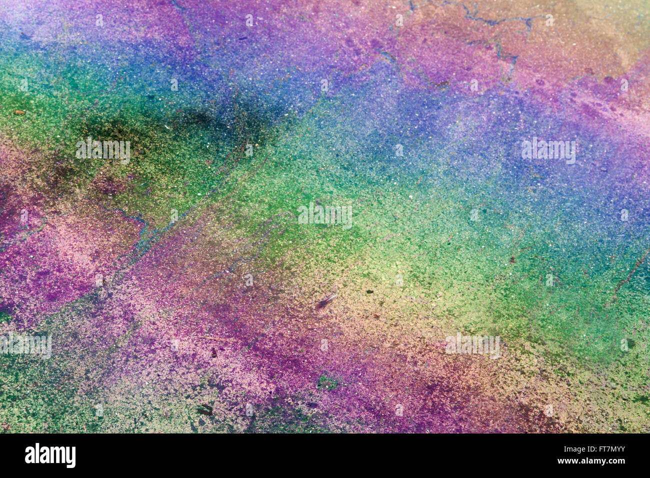 Oil on ground when wet cause rainbow on water on ground concrete Stock ...