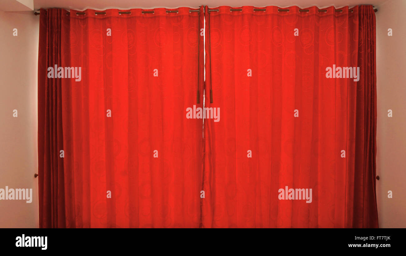 Window with red curtains closed in the interior of a room Stock Photo ...