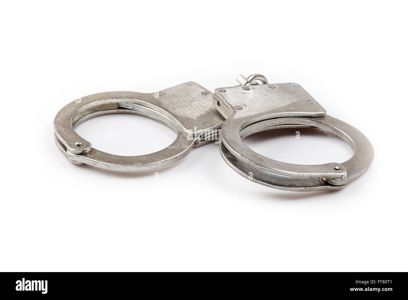 handcuffs on white background Stock Photo - Alamy