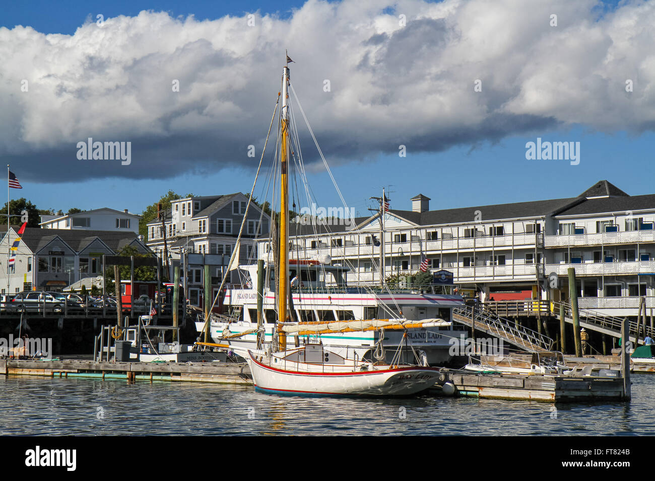 The Friendship Sloop Bay Lady lies alongside a float in Boothbay Harbor ...