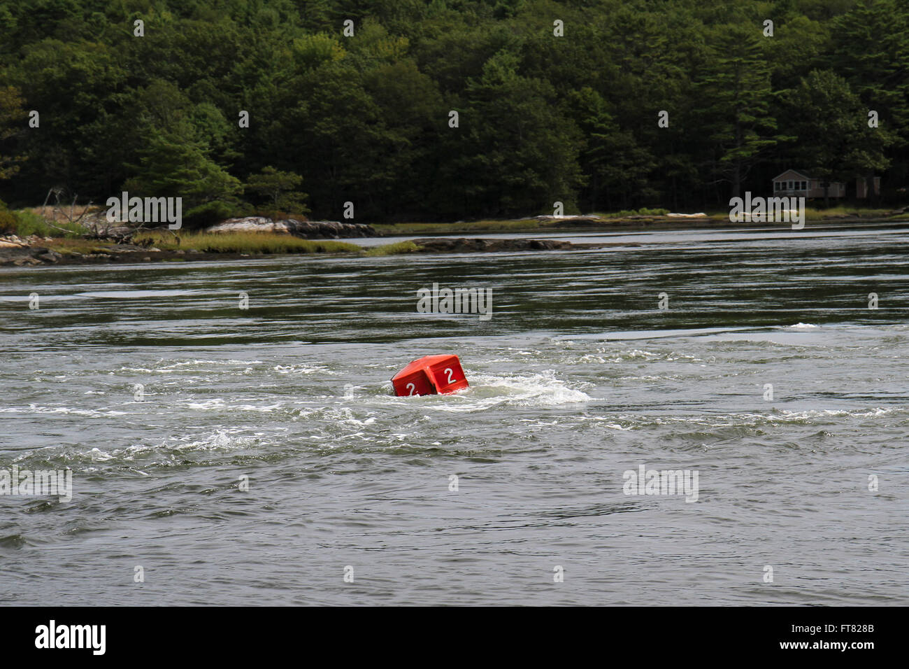 Navigation Buoy in fast flowing water at Lower Hell Gate in the Sasanoa ...