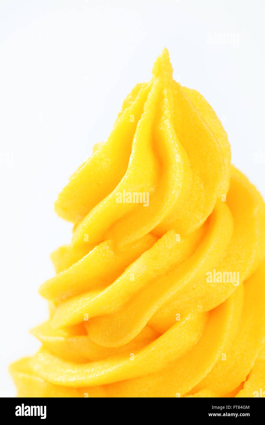 Swirl of yellow cream - detail Stock Photo - Alamy