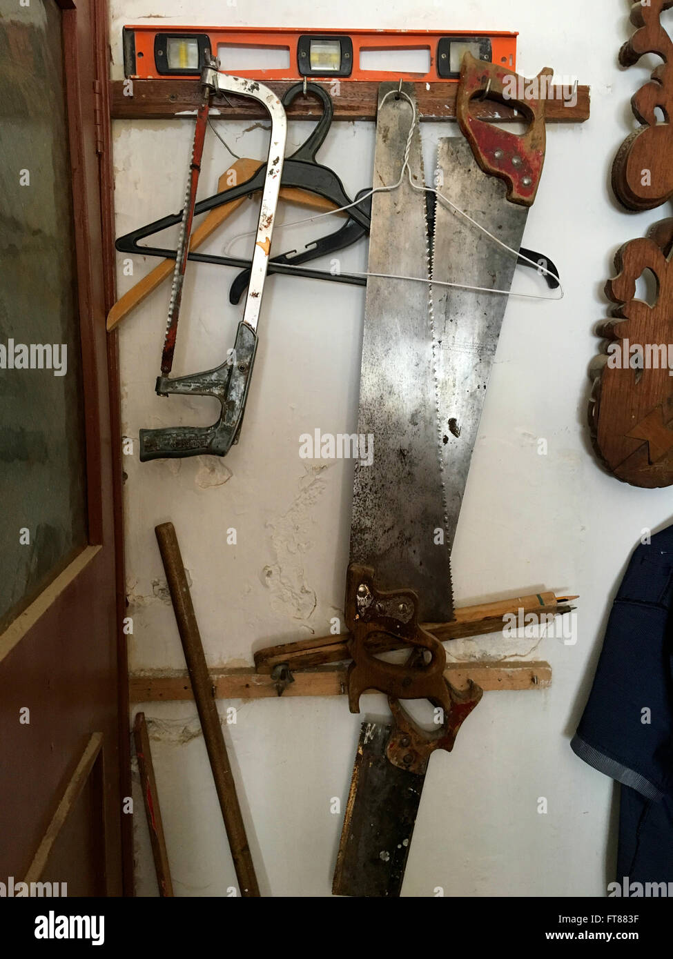 Tools hanging on the wall of a carpenter Stock Photo - Alamy