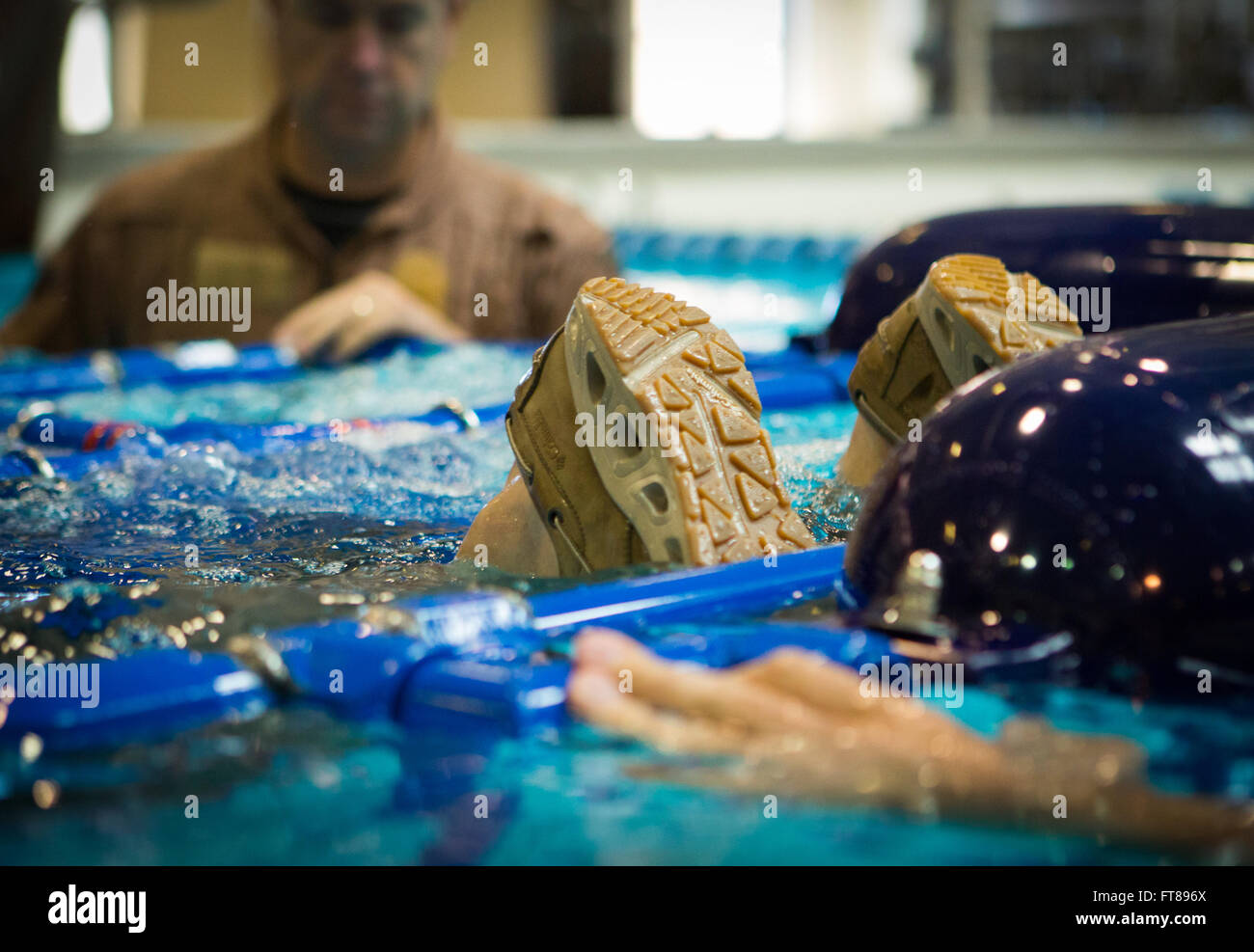 This image captures a CBP pilot undergoing inversion water training at ...