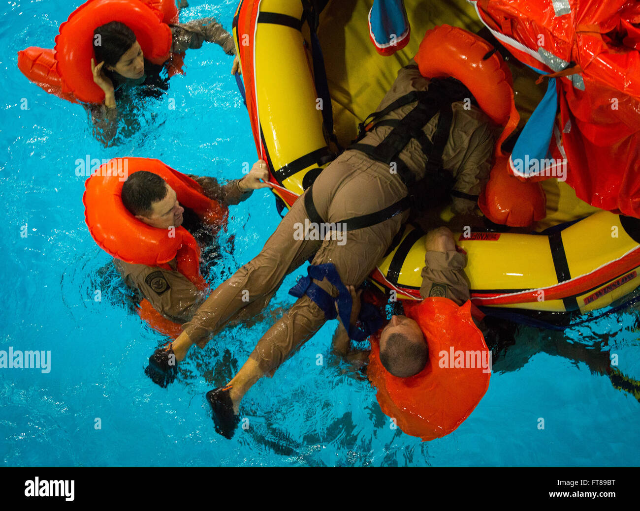 This image captures CBP pilots undergoing water survival training at ...