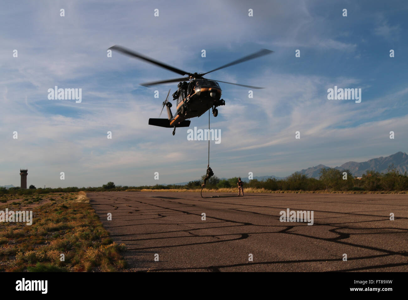 This image shows a joint fast rope training exercise between Air and ...