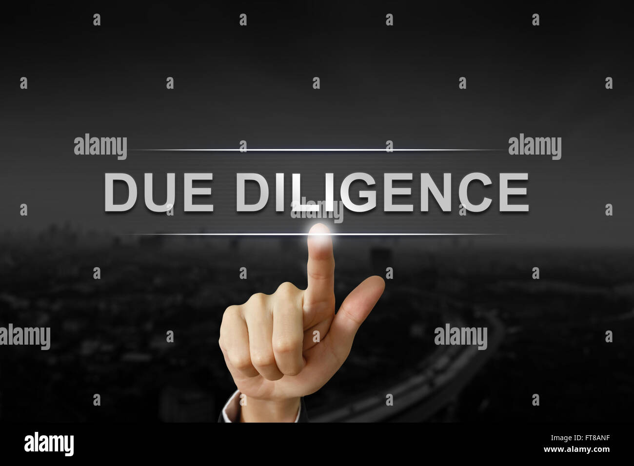 business hand clicking due diligence button on black blurred background ...