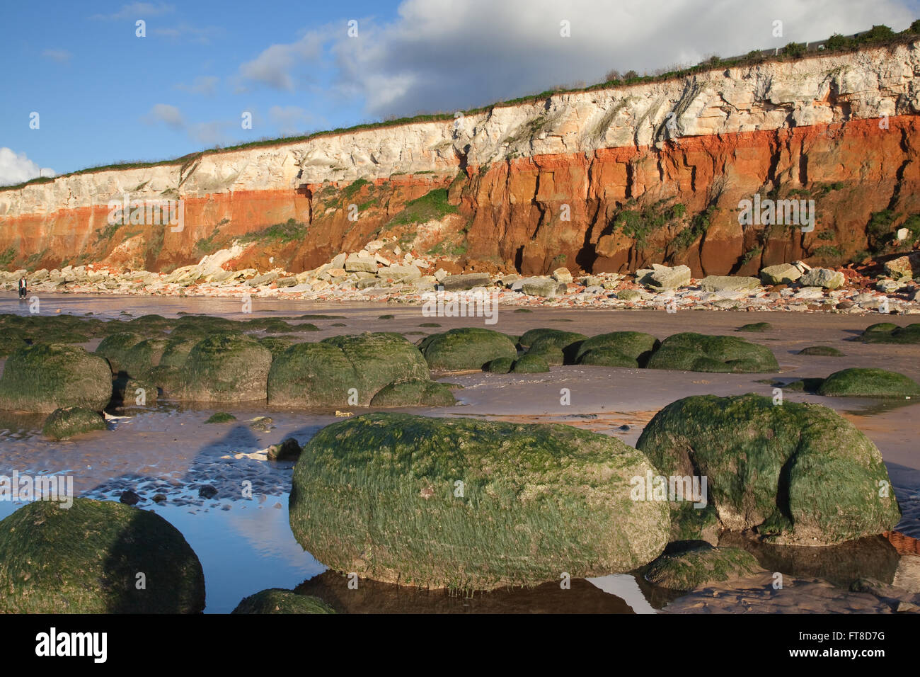 Hunstanton beach with the seaweed covered boulders and the carstone ...