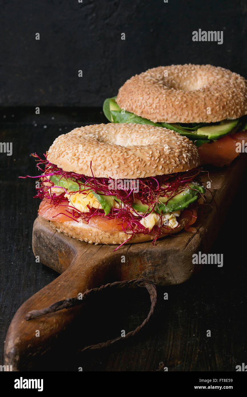 Two Bagels with salted salmon, spinach, beetroot sprouts, avocado and ...