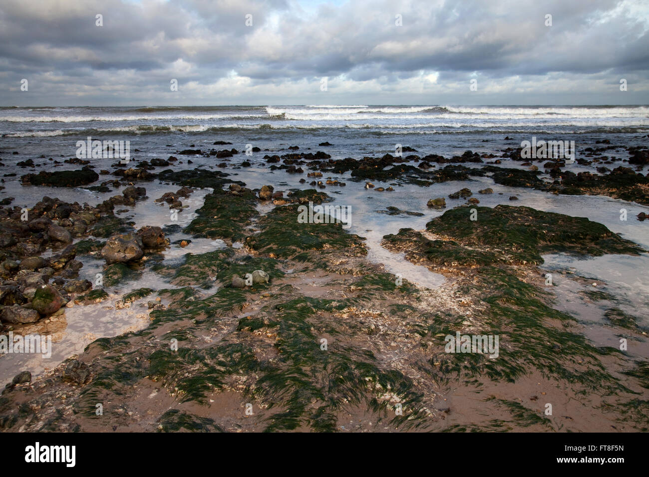 Hunstanton beach with the seaweed covered boulders and the carstone ...