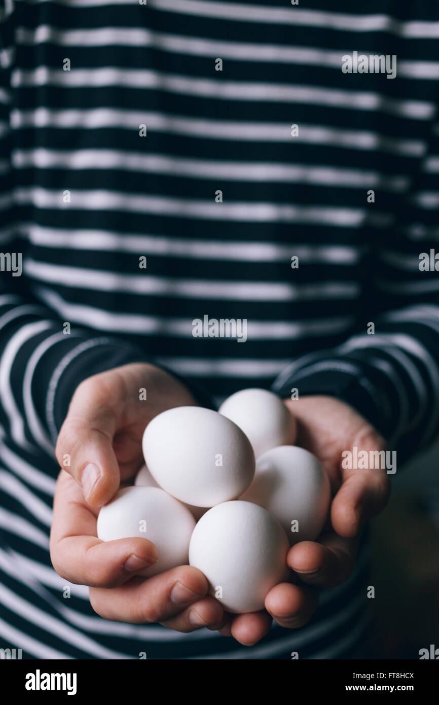 Eggs in hands Stock Photo - Alamy