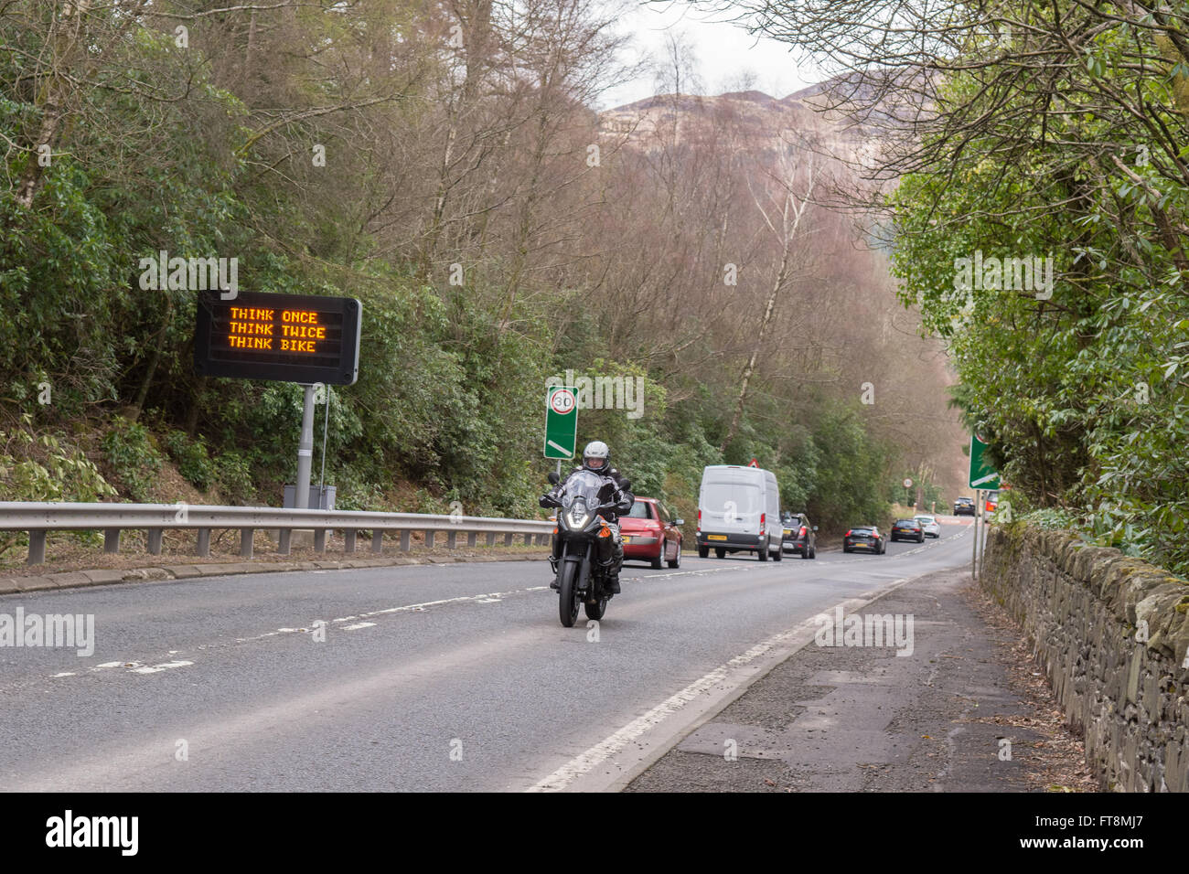'Think Once Think Twice Think Bike' traffic warning sign on A82 road ... 'Think Once Think Twice Think Bike' traffic warning sign on A82 road ...