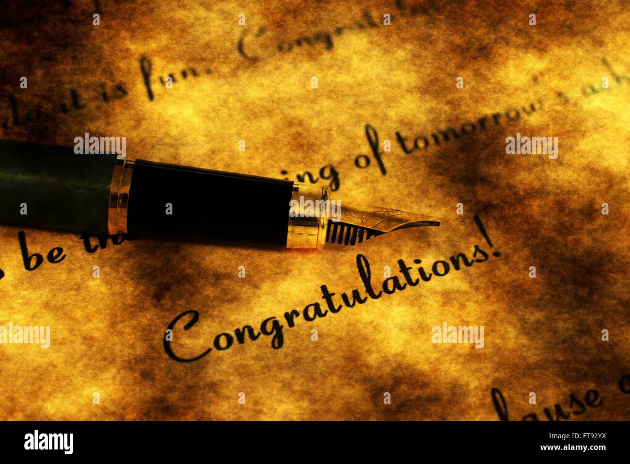 Fountain pen on congratulation text Stock Photo - Alamy