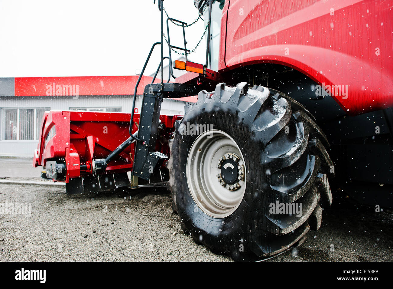 New red combine harvester at snowy weather Stock Photo - Alamy