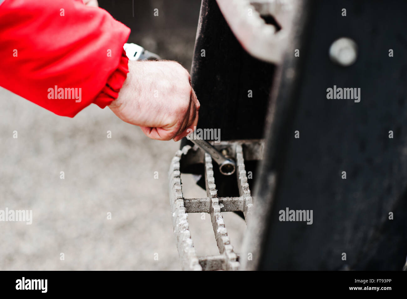 Mechanic hand hold spanner tool in hand at work Stock Photo - Alamy