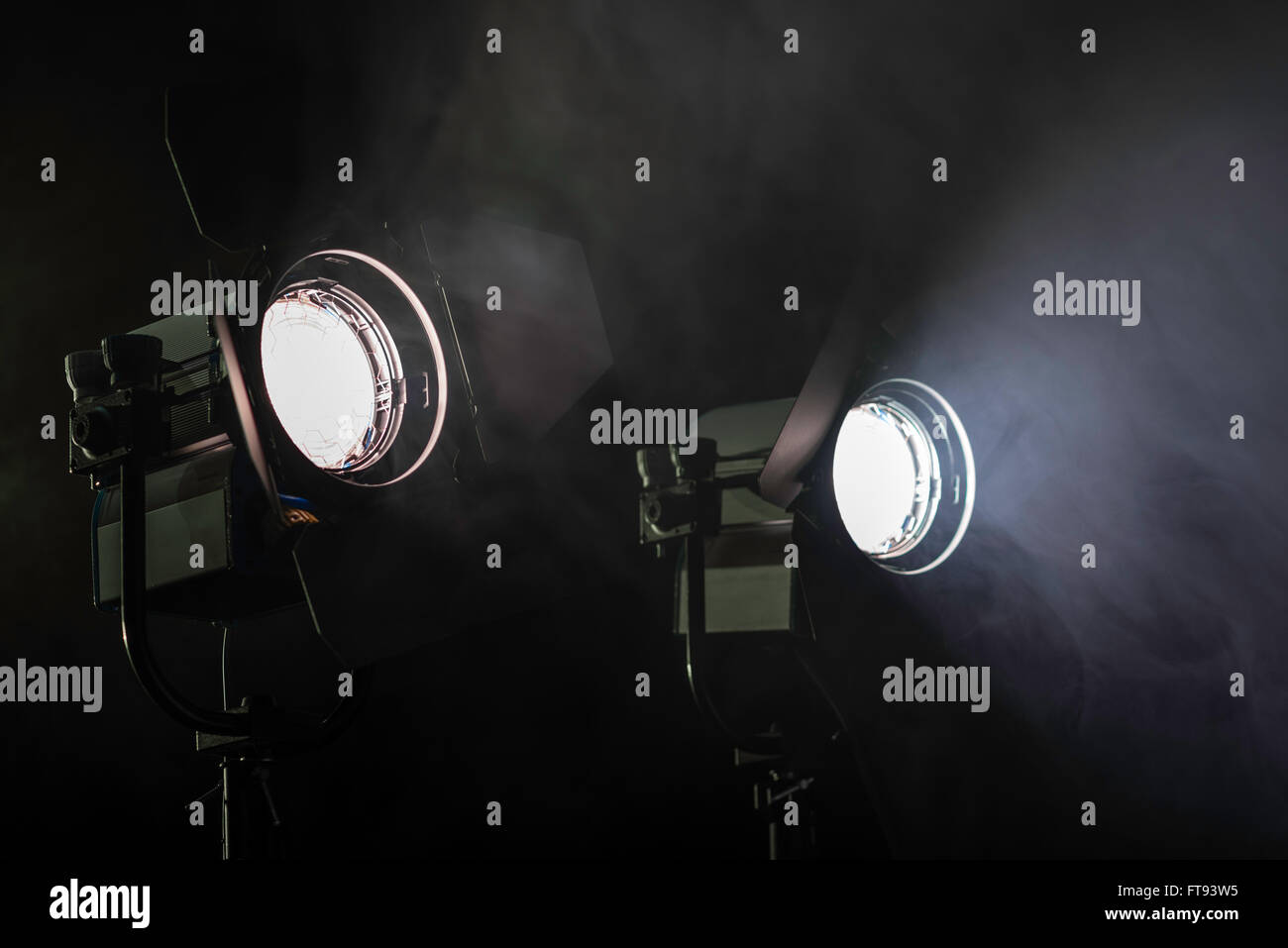 Two studio lights shining through the smoke from smoke machine Stock ...