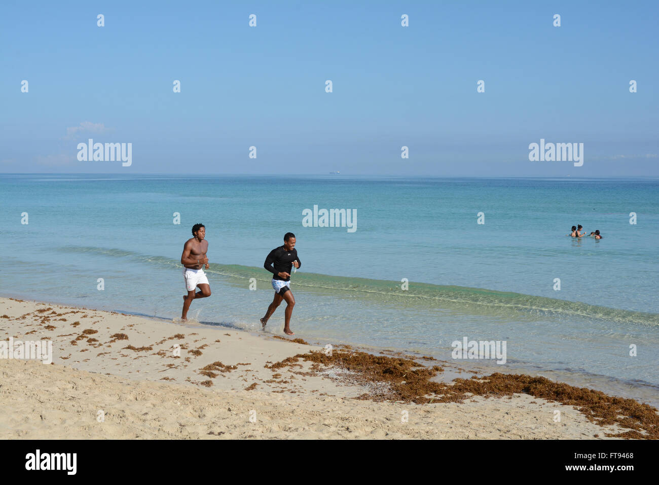 Men on beach hi-res stock photography and images - Alamy