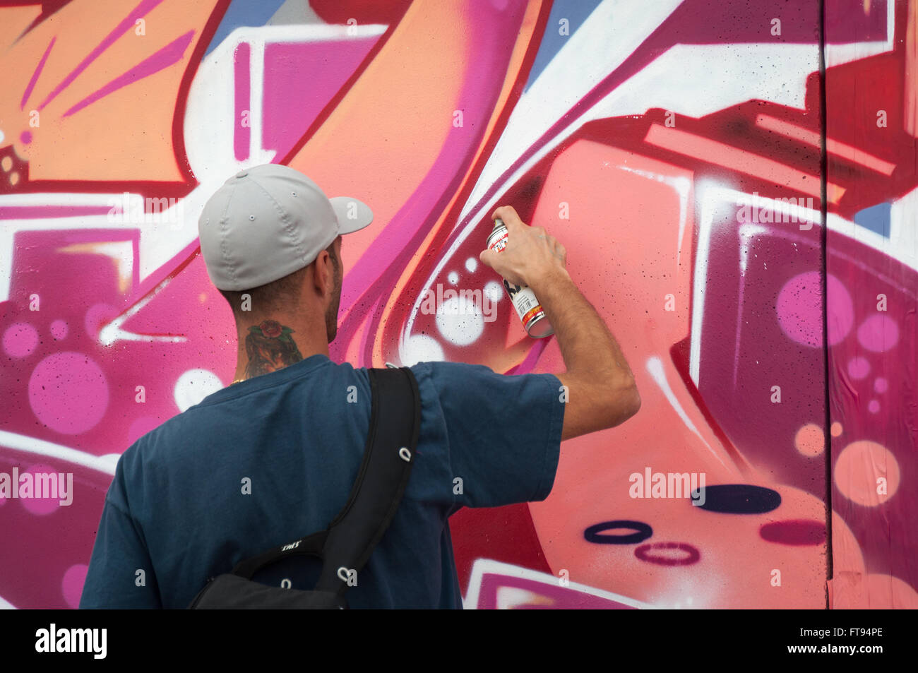 Artist painting graffiti Stock Photo - Alamy