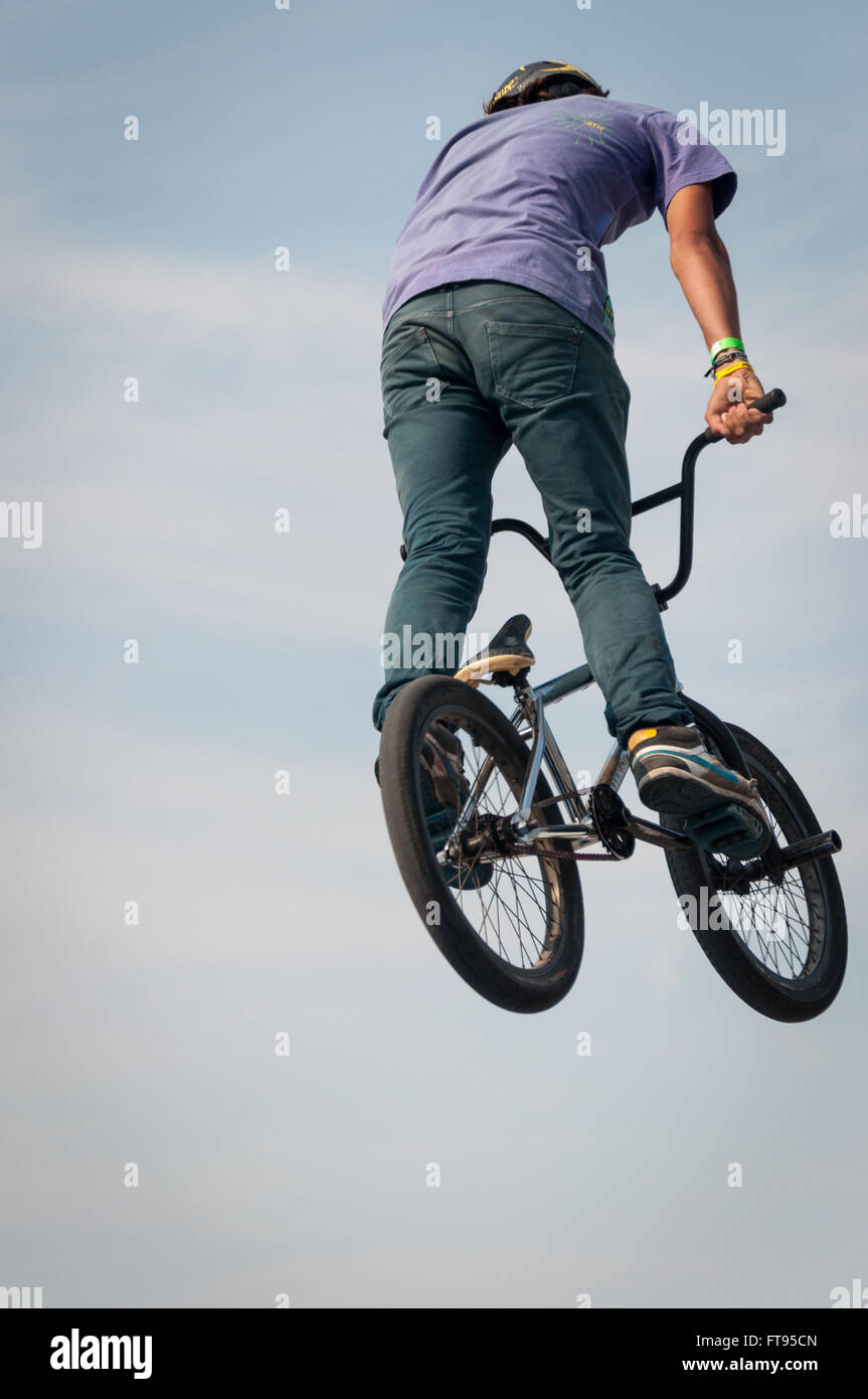 Male BMX biker in mid-air performing dirt jumping Stock Photo - Alamy