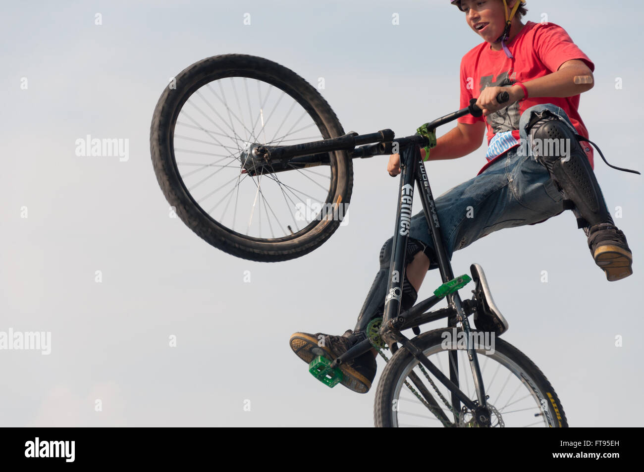 BMX biker close-up jumping mid-air performing dirt jumping Stock Photo ...