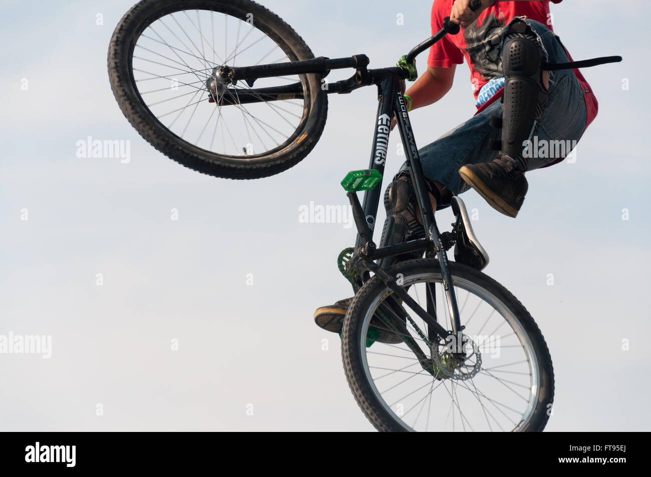 BMX biker close-up jumping mid-air performing dirt jumping Stock Photo ...