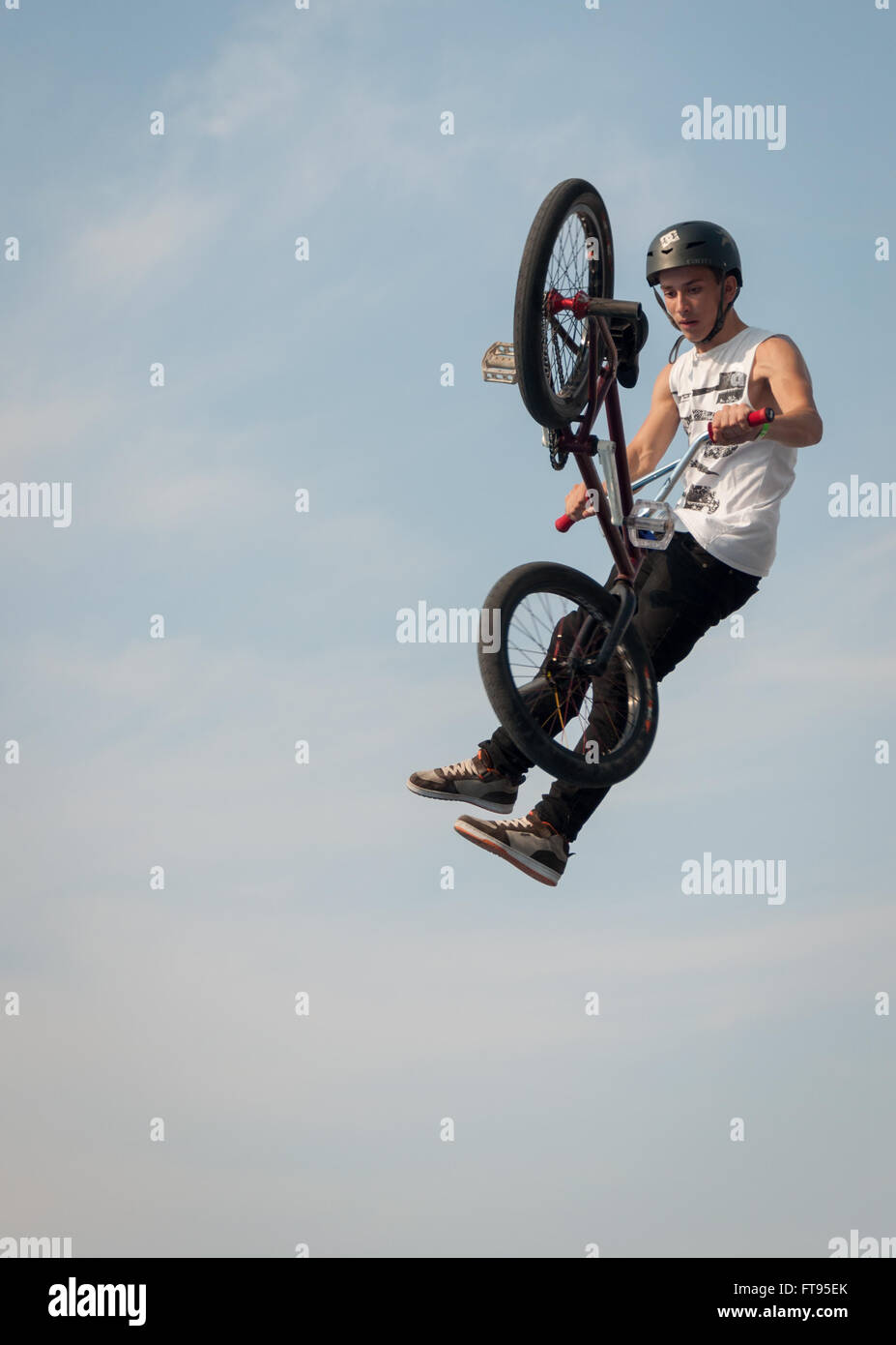 BMX biker jumping mid-air performing dirt jumping Stock Photo - Alamy