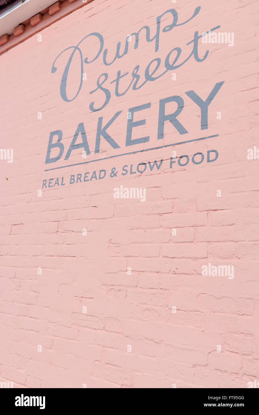 Orford Pump Street Bakery, view of the pink wall and signage of the ...