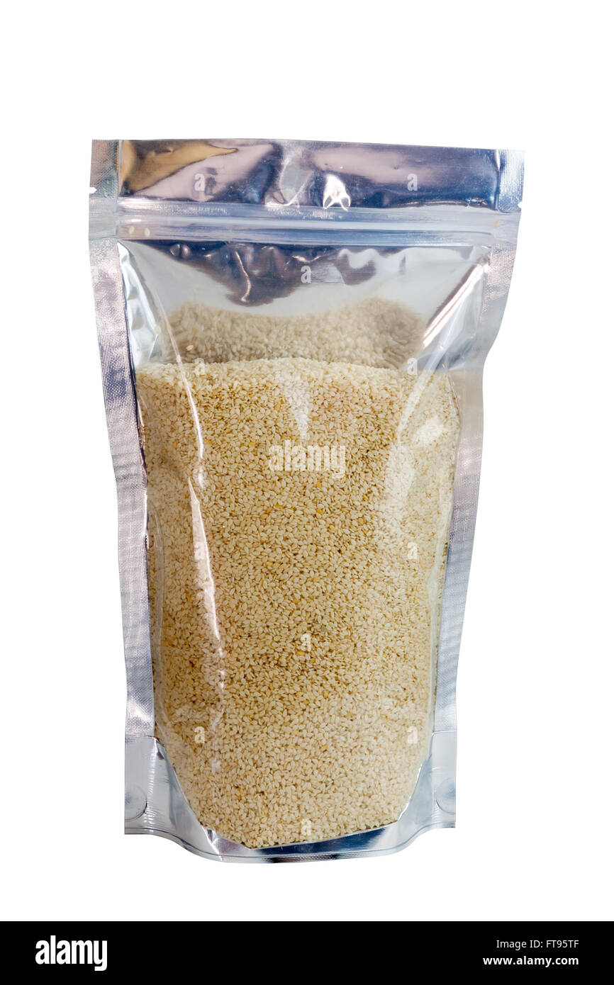 White sesame seeds in packaging foil zip lock bag. Isolated on white ...