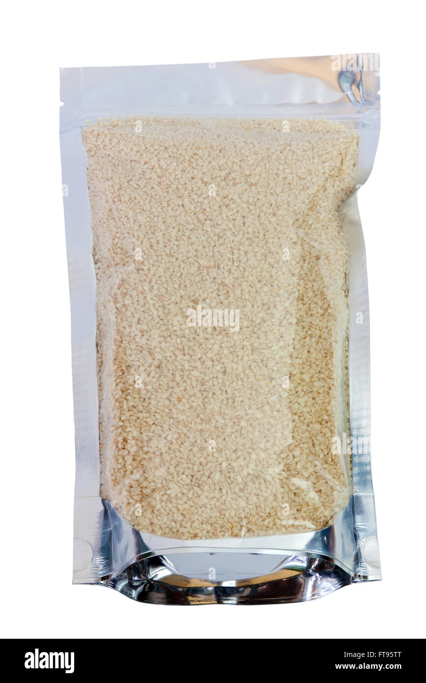 White sesame seeds in packaging foil zip lock bag. Isolated on white ...