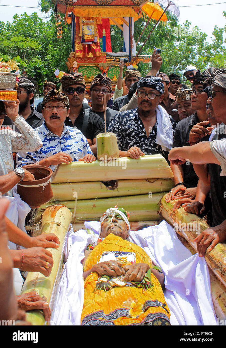 The covered body of a man lies in a cremation casket at the cremation ...