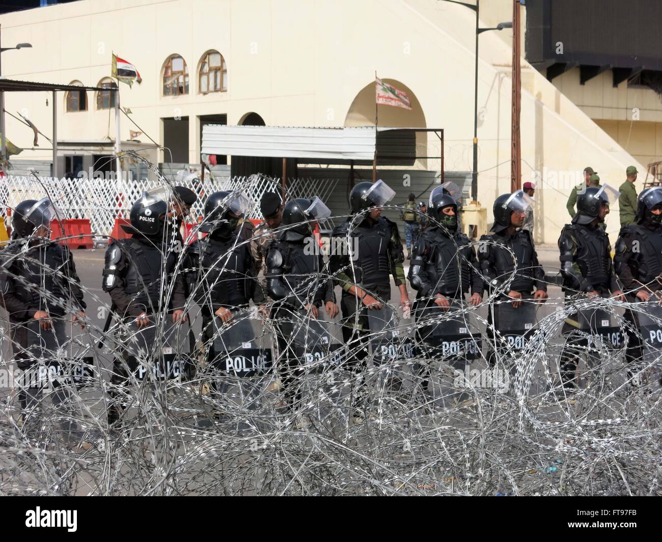 Baghdad. 25th Mar, 2016. Iraqi security forces stand guard at Tahrir ...
