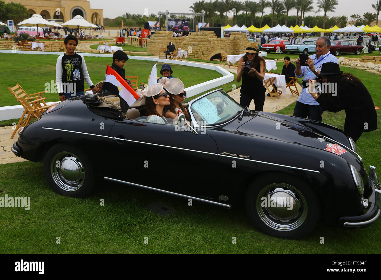 Cairo, Egypt. 25th Mar, 2016. Visitors take photos of a classic car ...