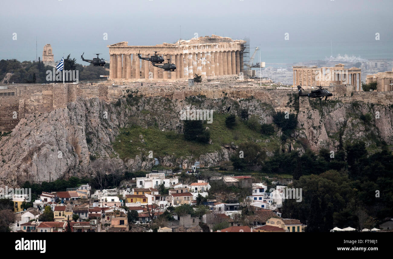Athens, Greece. 25th Mar, 2016. Military helicopters fly over the ...