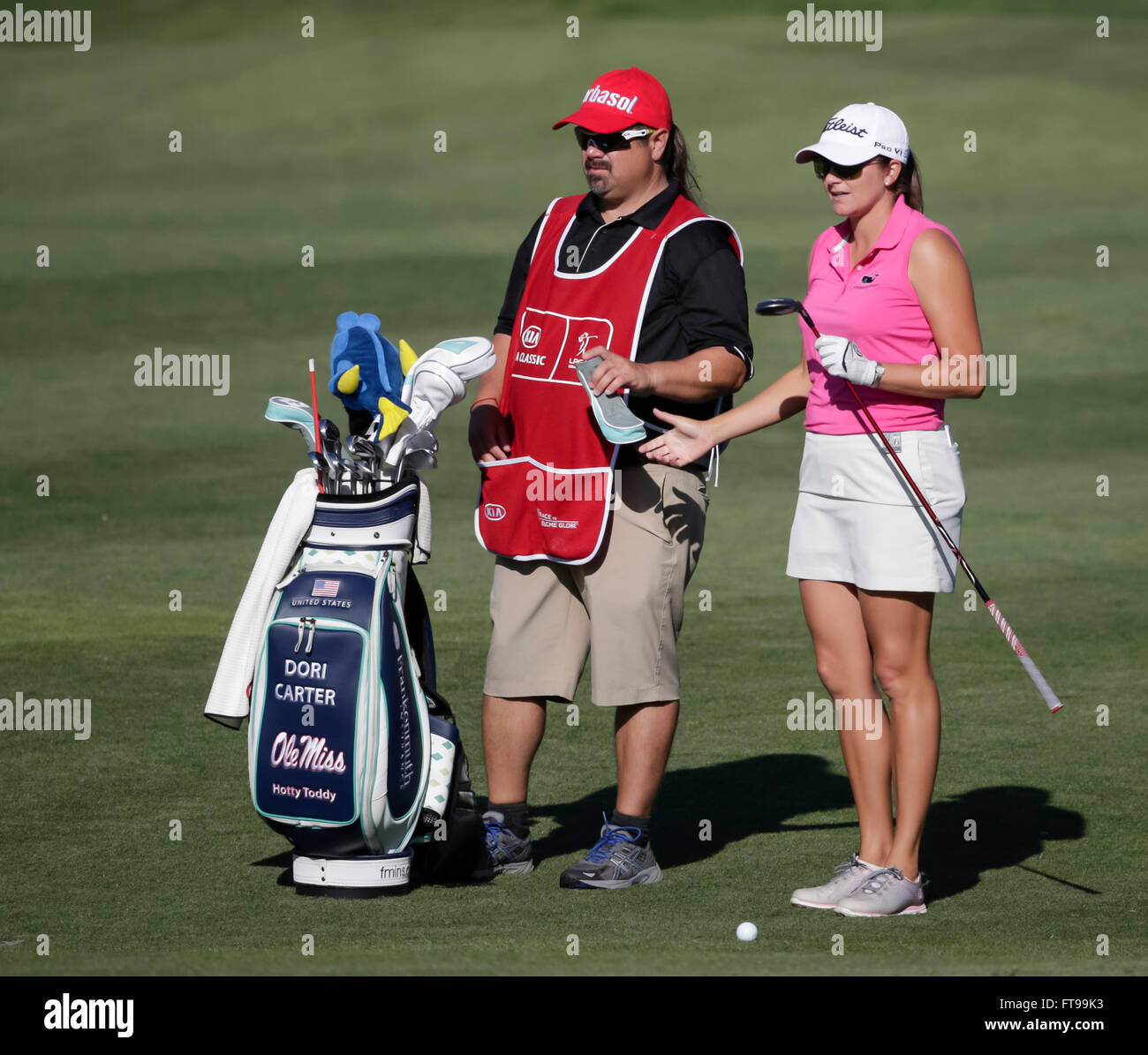Carlsbad, California, USA. 25th Mar, 2016. Dori Carter hands a head ...