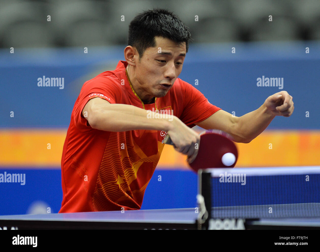 Doha, Qatar. 26th Mar, 2016. Zhang Jike of China returns the ball ...