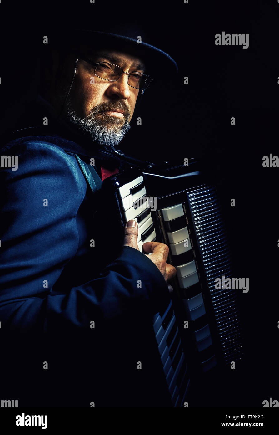 Portrait of an accordion player, playing and posing Stock Photo - Alamy