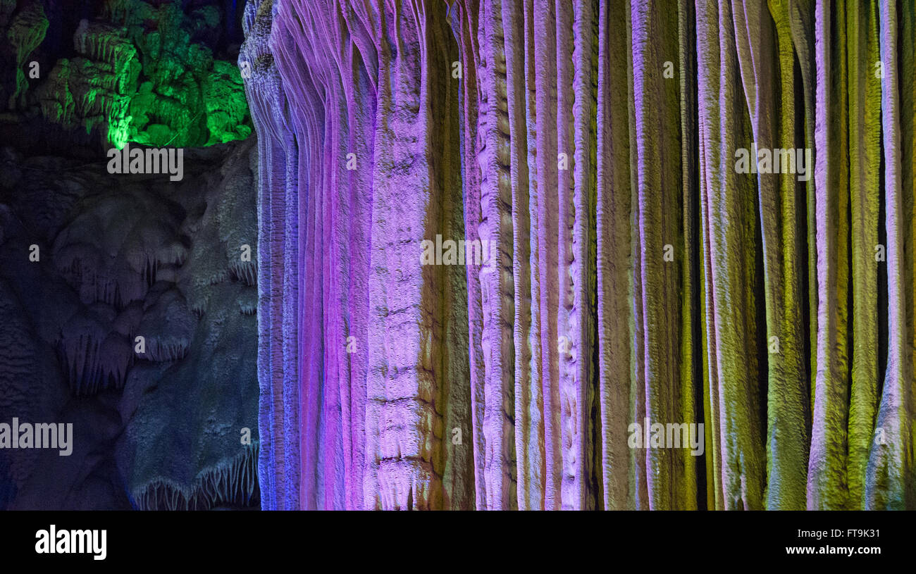 Colored rock cave background Stock Photo - Alamy