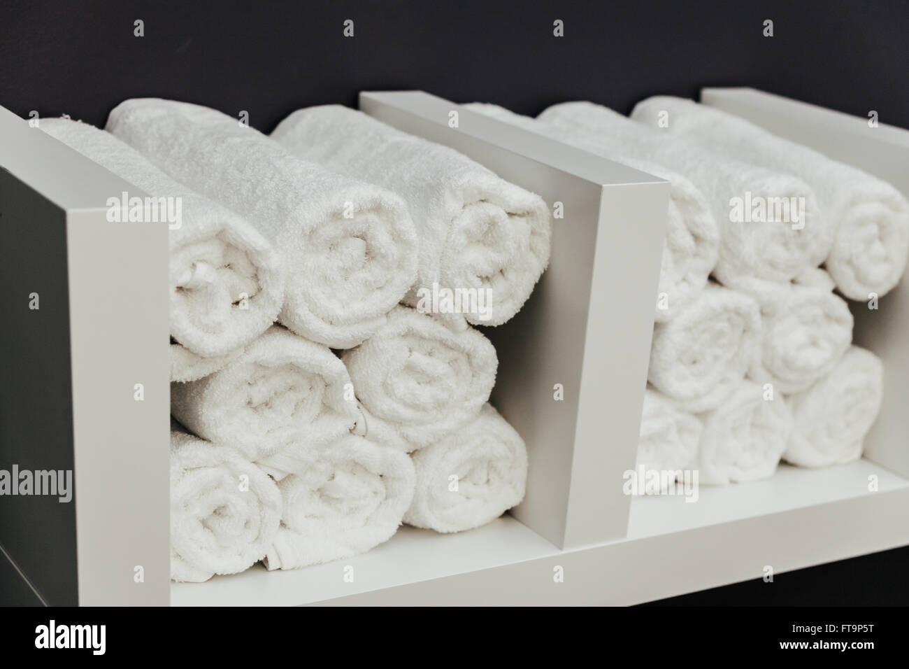 stack of clean towels on simple background Stock Photo - Alamy