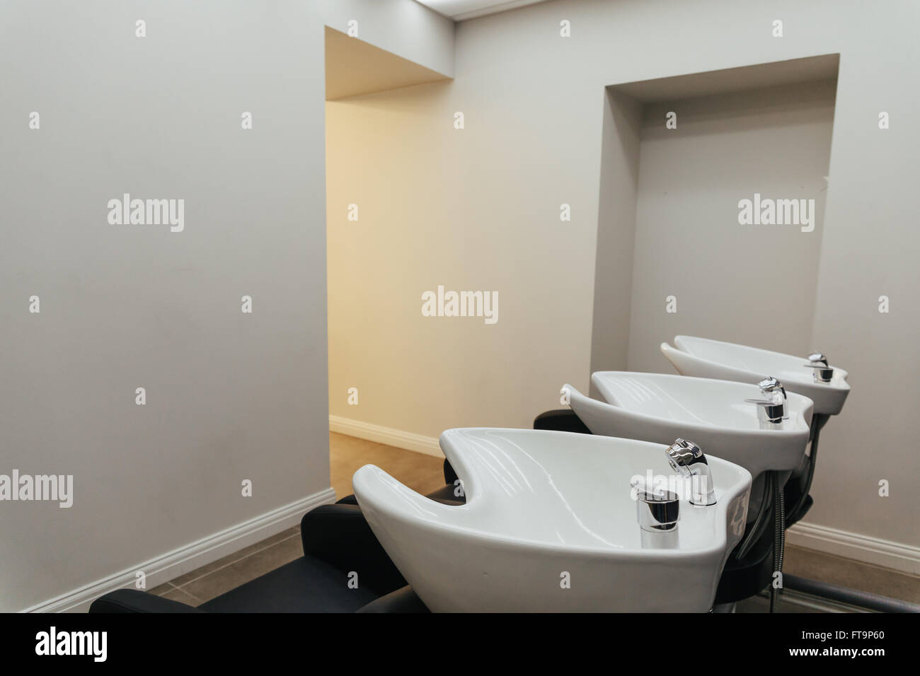 Interior of luxury beauty salon with sinks Stock Photo - Alamy