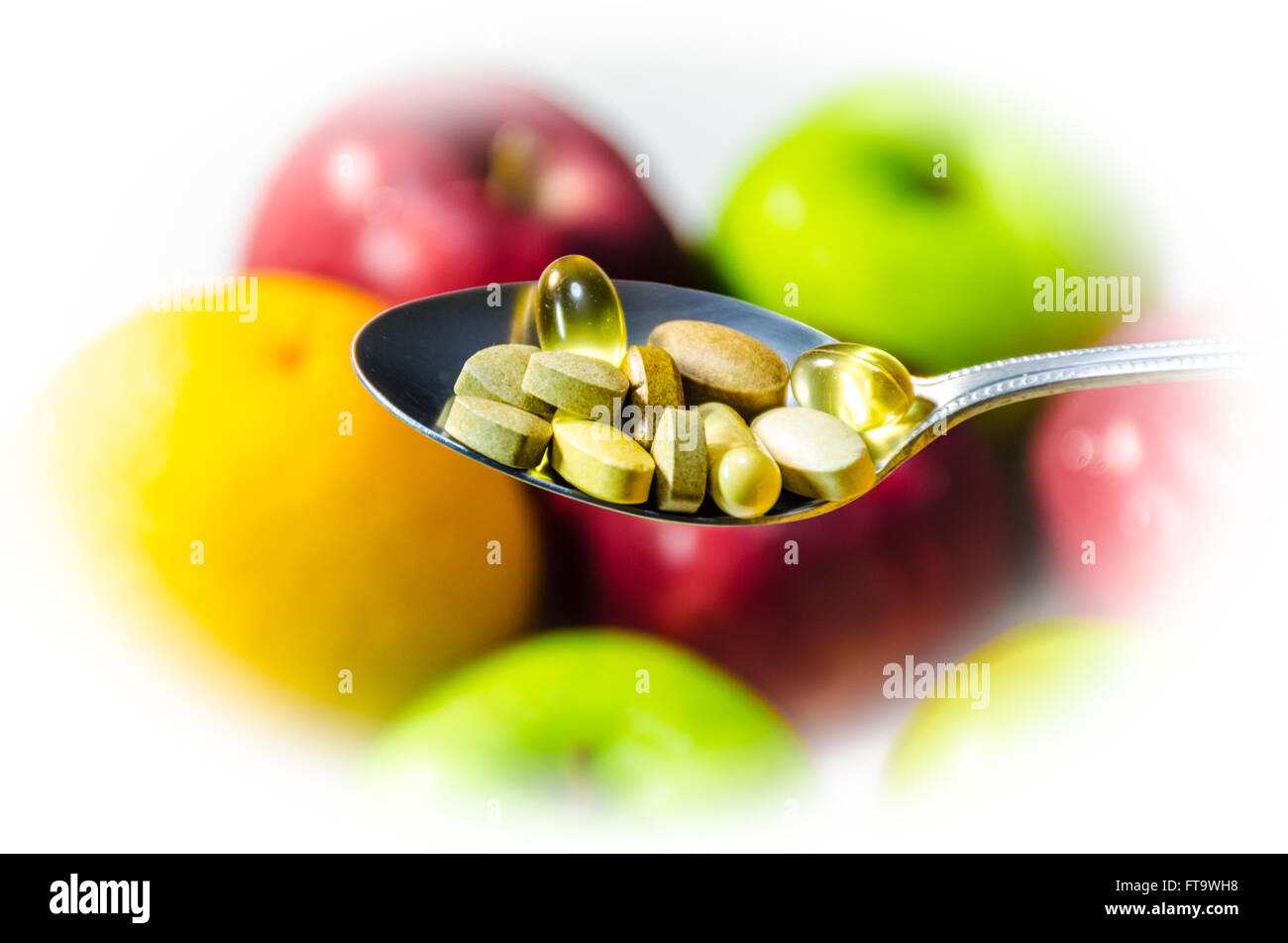 Capsules with food supplements in spoon hi-res stock photography and ...