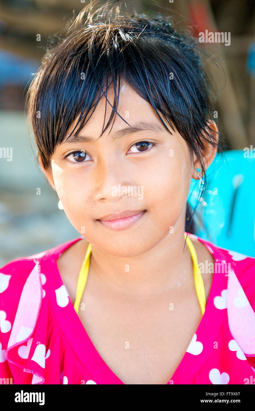 Pretty young Asian Thai girl smiling with beautiful eyes on the beach ...